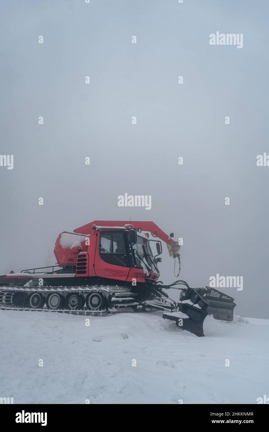 Vertical shot of a Snowcat in a mountainside Stock Photo - Alamy