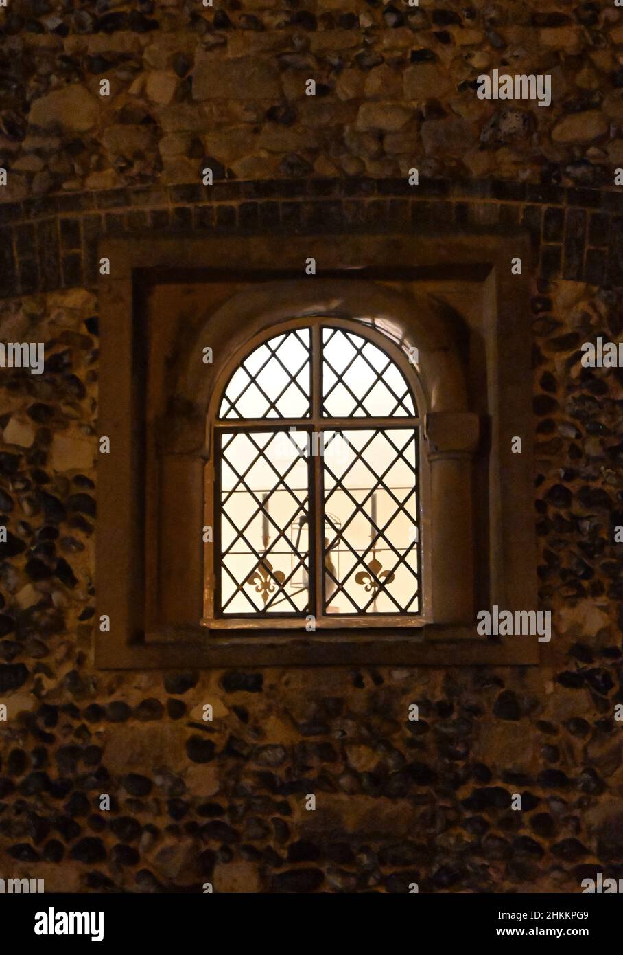 lit window in historic building, bury st edmunds, suffolk, england ...