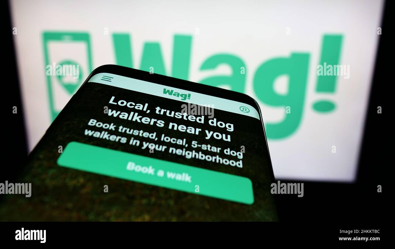 Mobile phone with website of US pet care company Wag Labs Inc. on ...