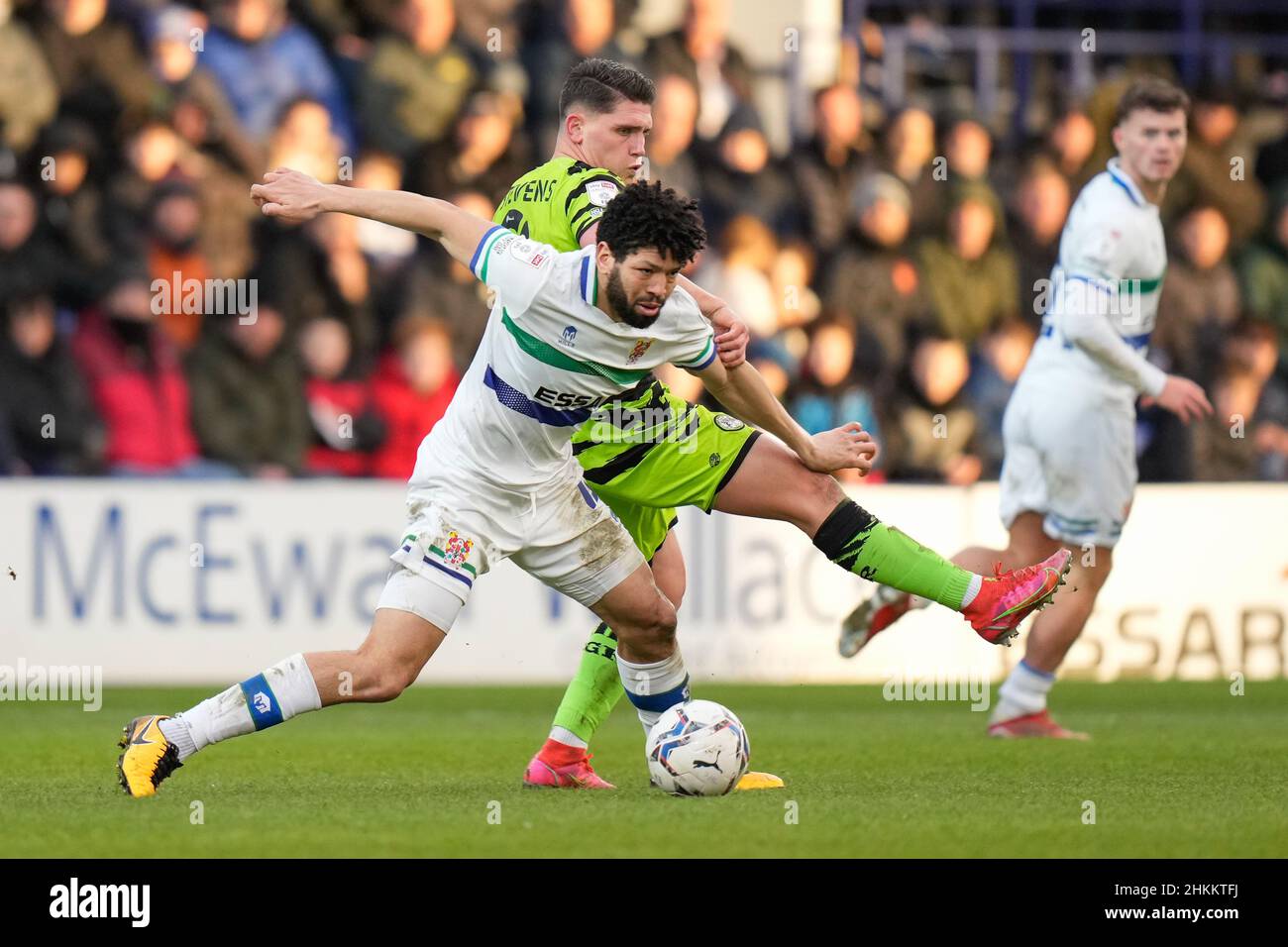 Mathew Stevens of Forrest Green competes for the ball with Nat Knight ...