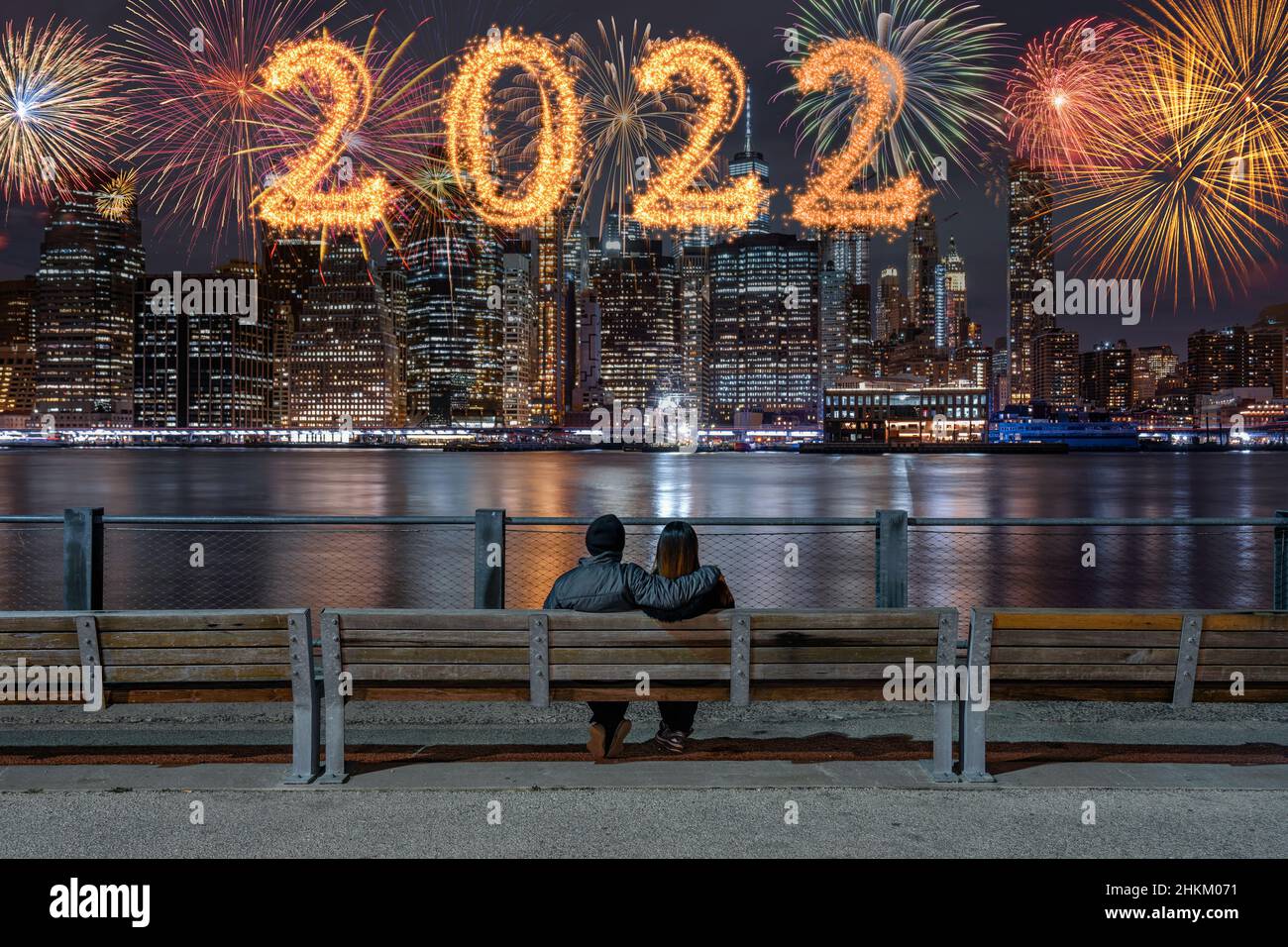 2022 written with Sparkle firework with multicolor of fireworks on back ...