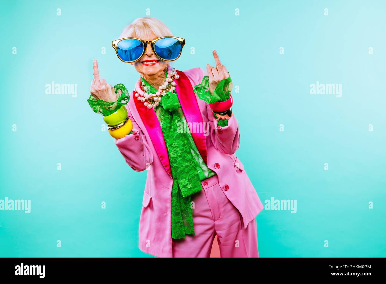 Happy and funny cool old lady with fashionable clothes portrait on ...