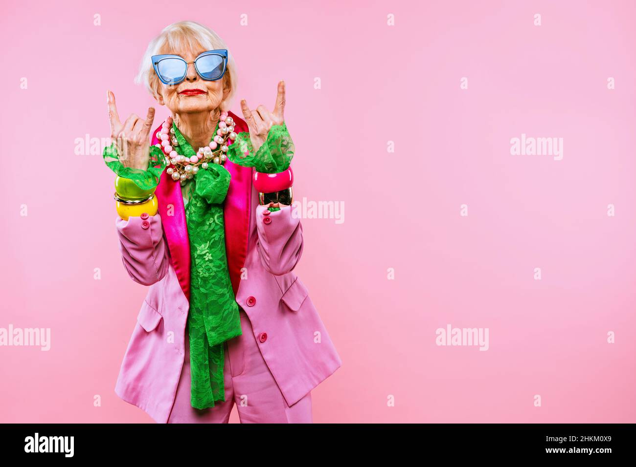 Happy and funny cool old lady with fashionable clothes portrait on ...