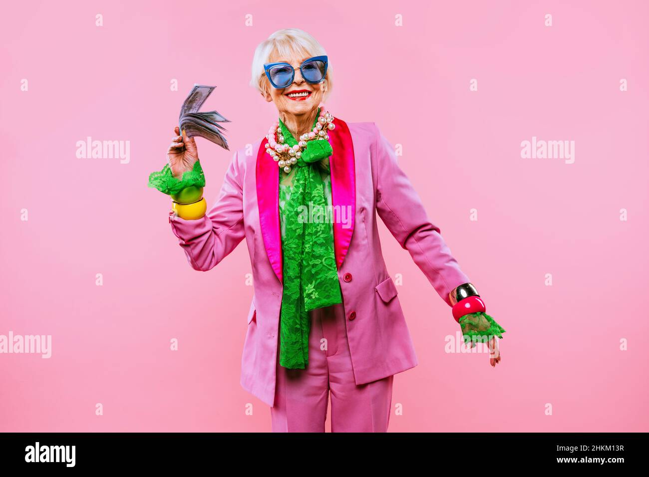 Happy and funny cool old lady with fashionable clothes portrait on ...