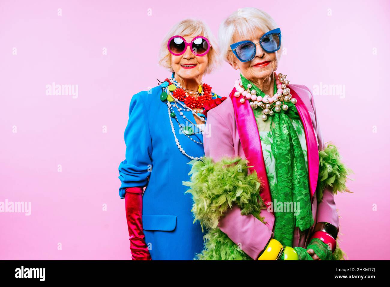 Happy and funny cool old ladies with fashionable clothes portrait on ...