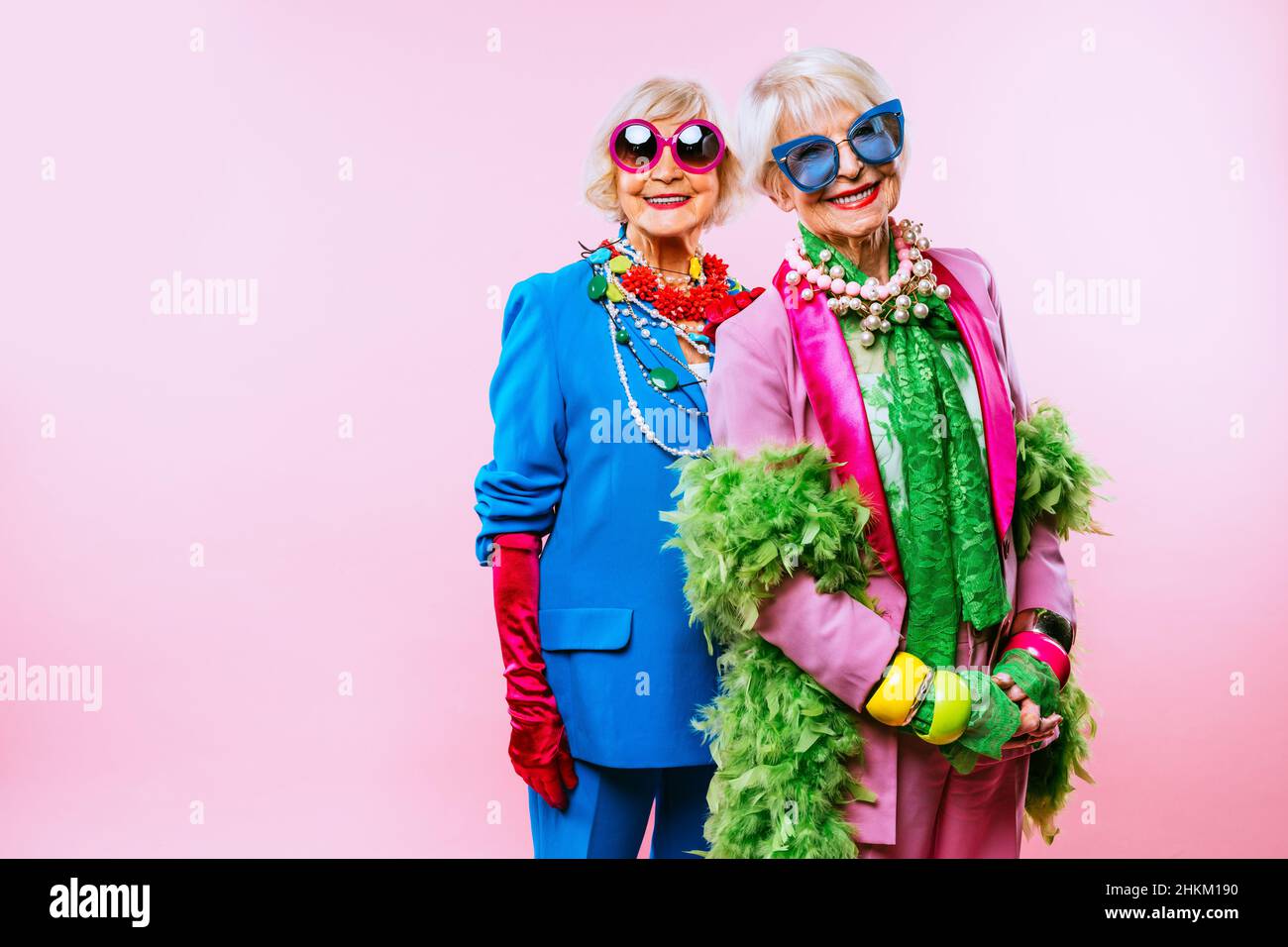 Happy and funny cool old ladies with fashionable clothes portrait on ...