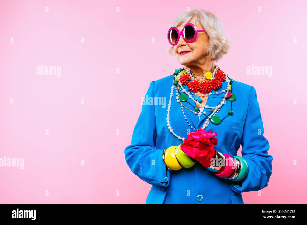 Happy and funny cool old lady with fashionable clothes portrait on ...