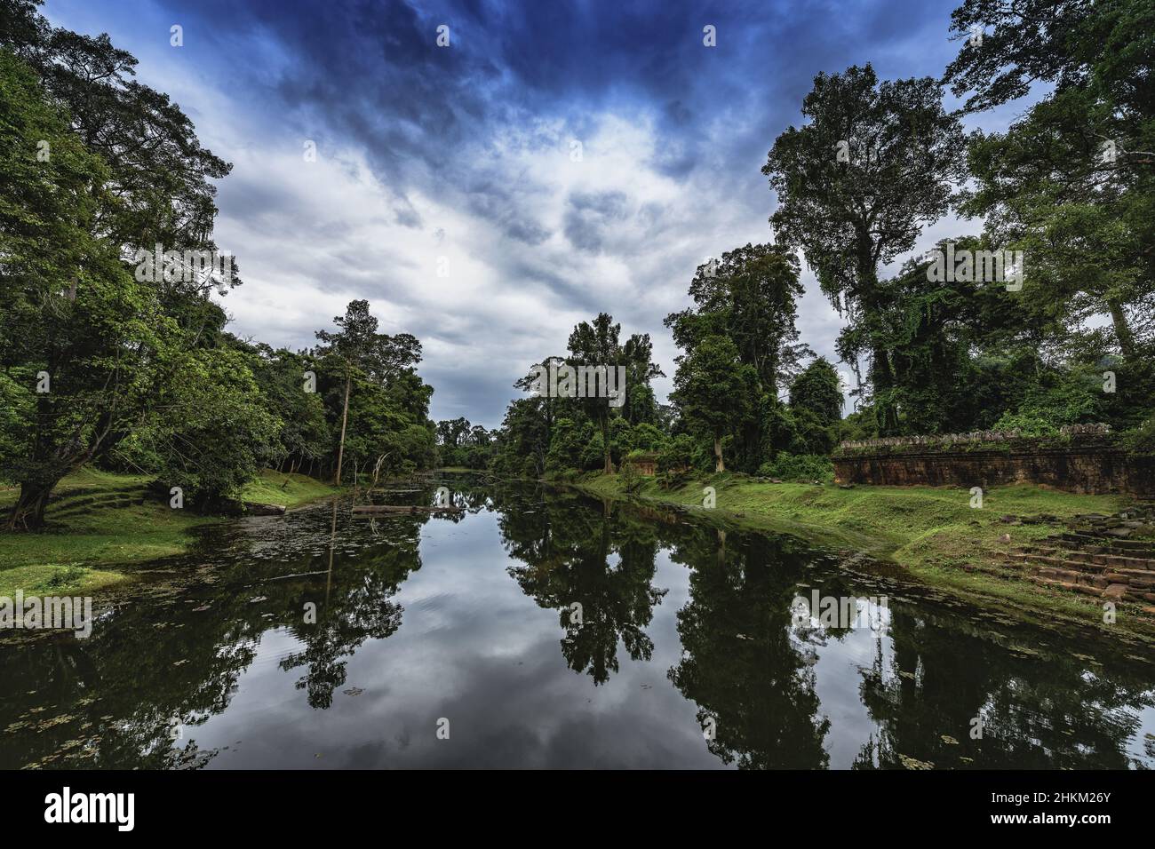 A canal reflecting the surrounding at Angkor Wat in Cambodia Stock ...
