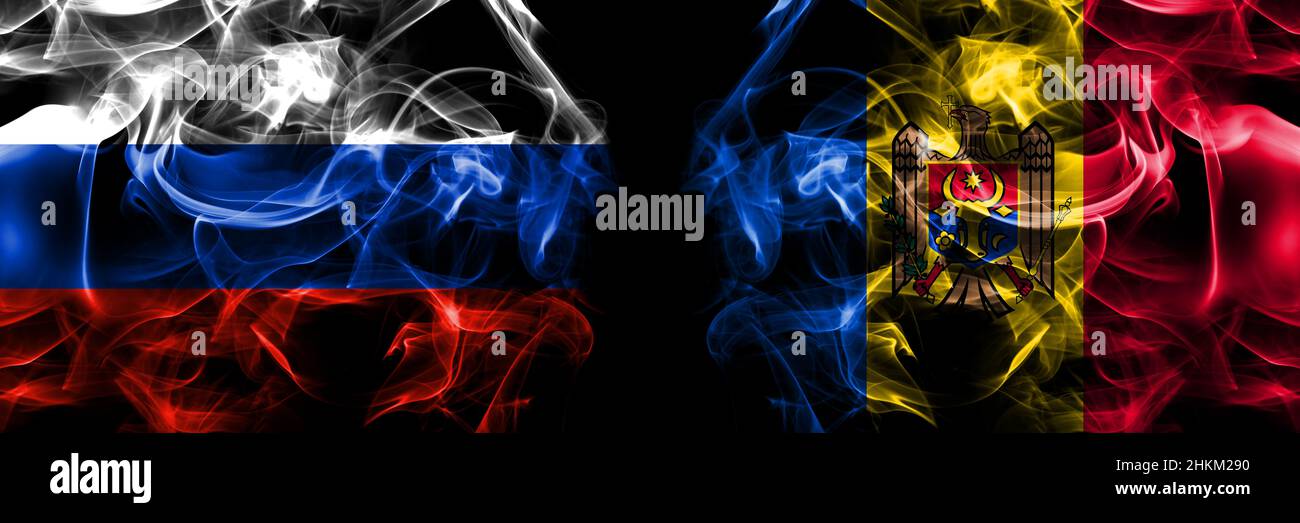 Russia, Russian vs Moldova, Moldovan flags. Smoke flag placed side by ...