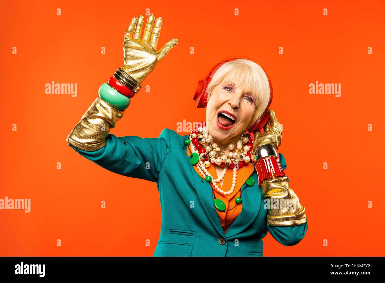 Happy and funny cool old lady with fashionable clothes portrait on ...