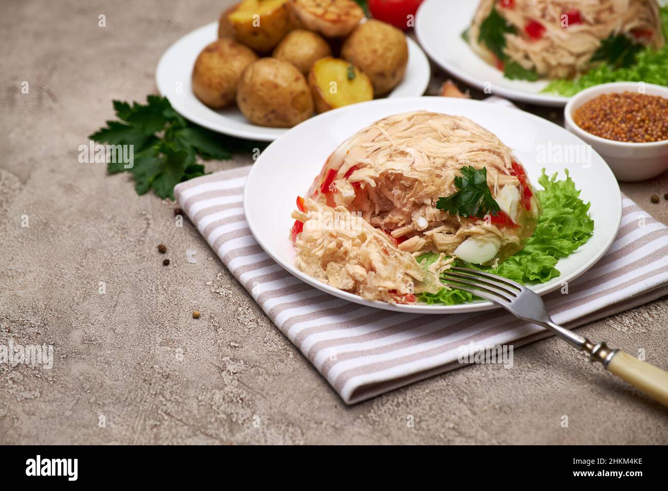 Delicious chicken aspic on a plate on concrete table Stock Photo - Alamy