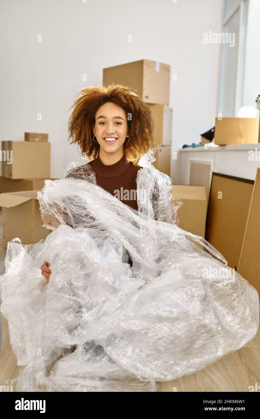 Woman wrapped in packing bubble tape portrait Stock Photo - Alamy