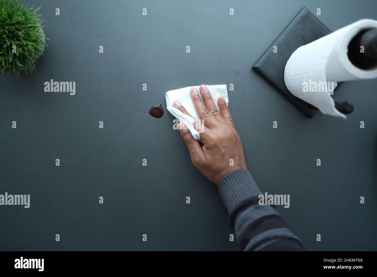 person hand cleaning table with cloth on black background Stock Photo ...