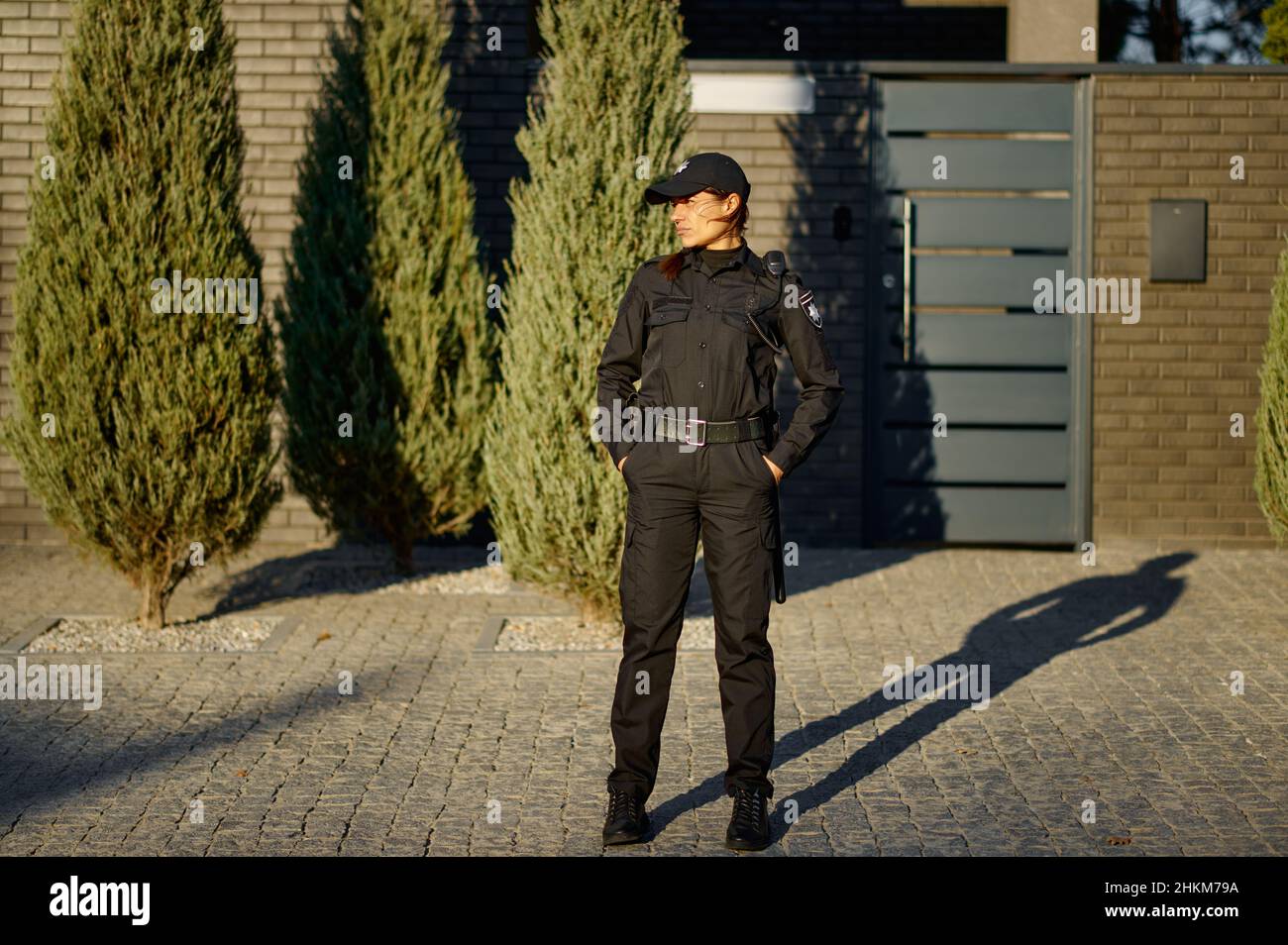 Woman police officer on street full-length portrait Stock Photo - Alamy