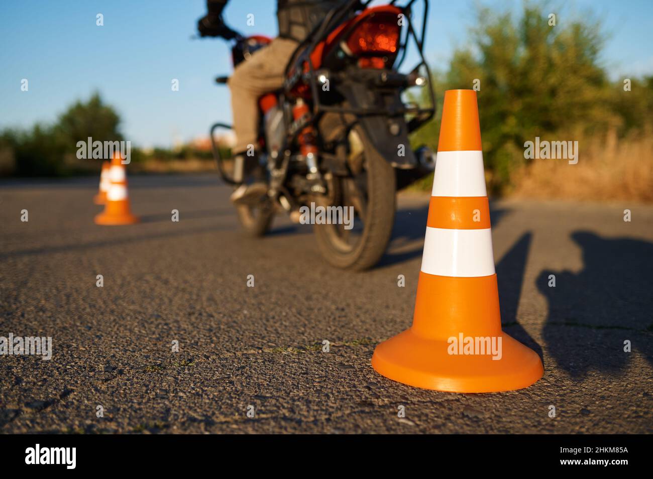 Student on motorbike, snake riding between cones Stock Photo - Alamy