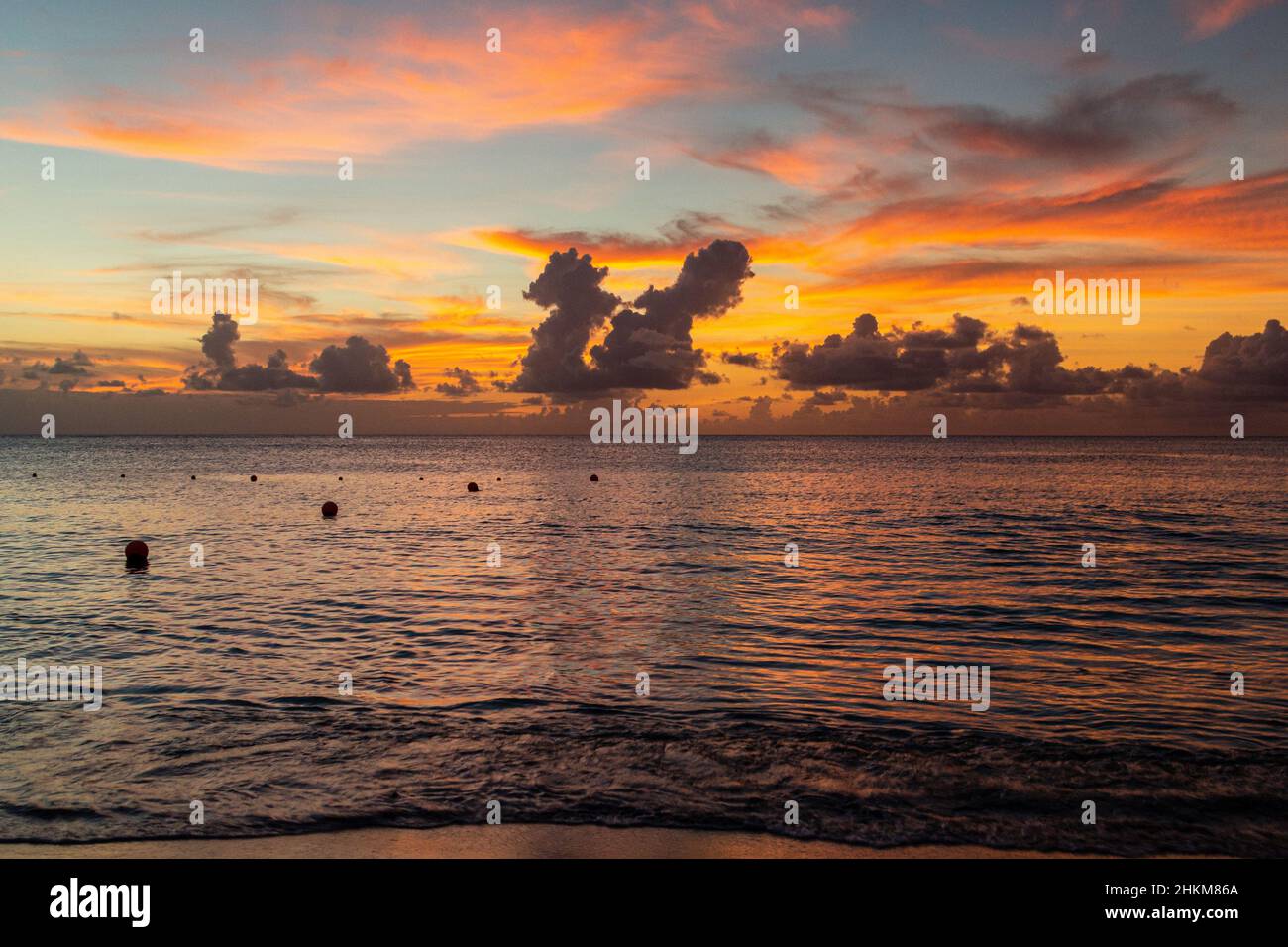 View of the sea with puffy clouds in the sky at the sunset in Glitter ...