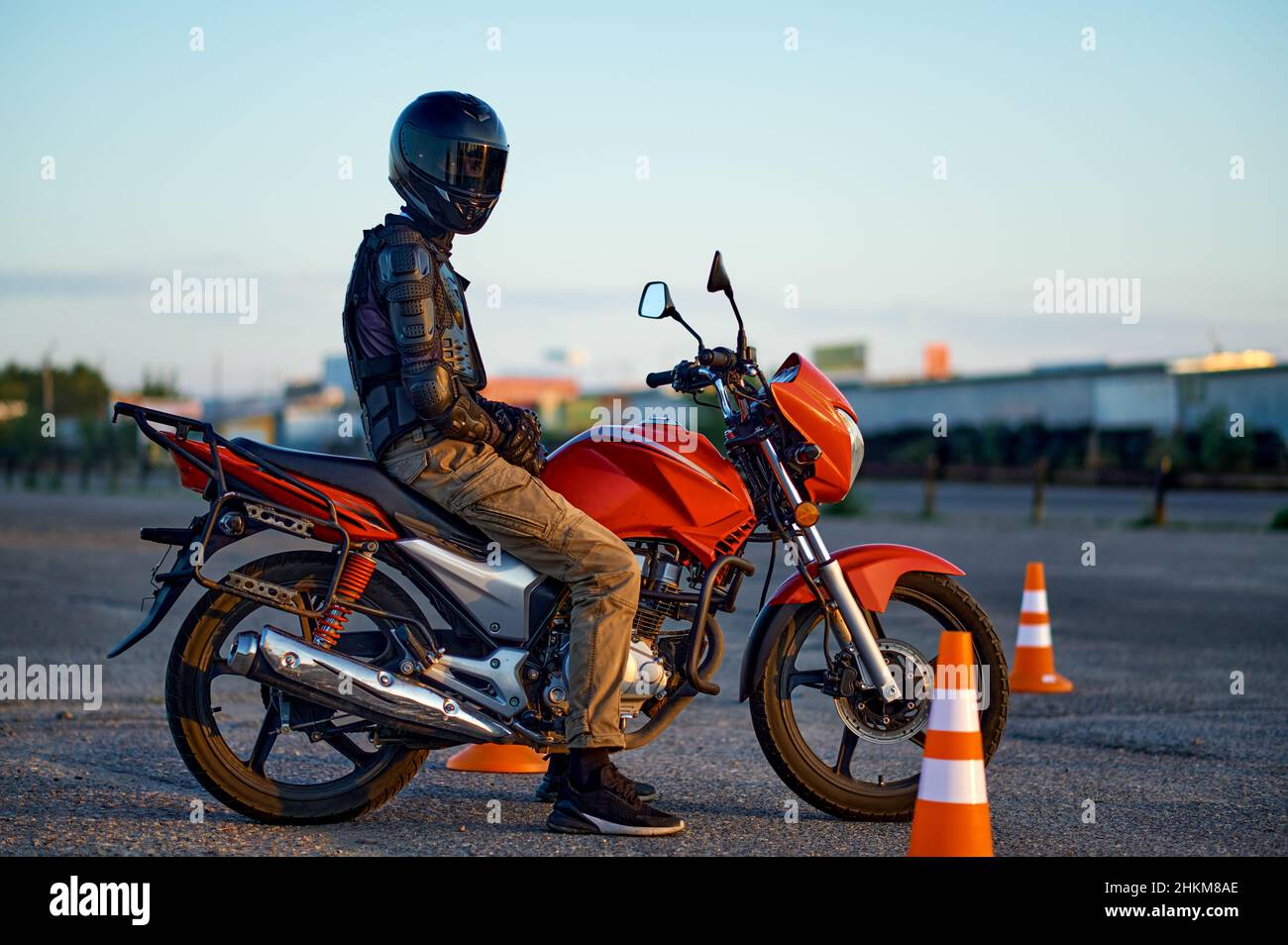 Male student poses on motorbike, motorcycle school Stock Photo - Alamy