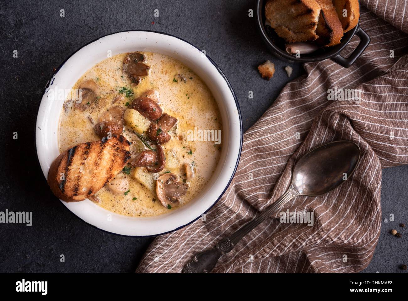 Porcini mushrooms soup with cream and bread Stock Photo - Alamy