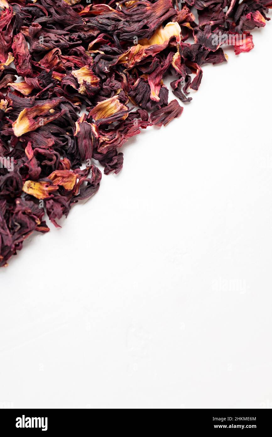 Dried hibiscus calyces on white background. Heap of dried hibiscus ...