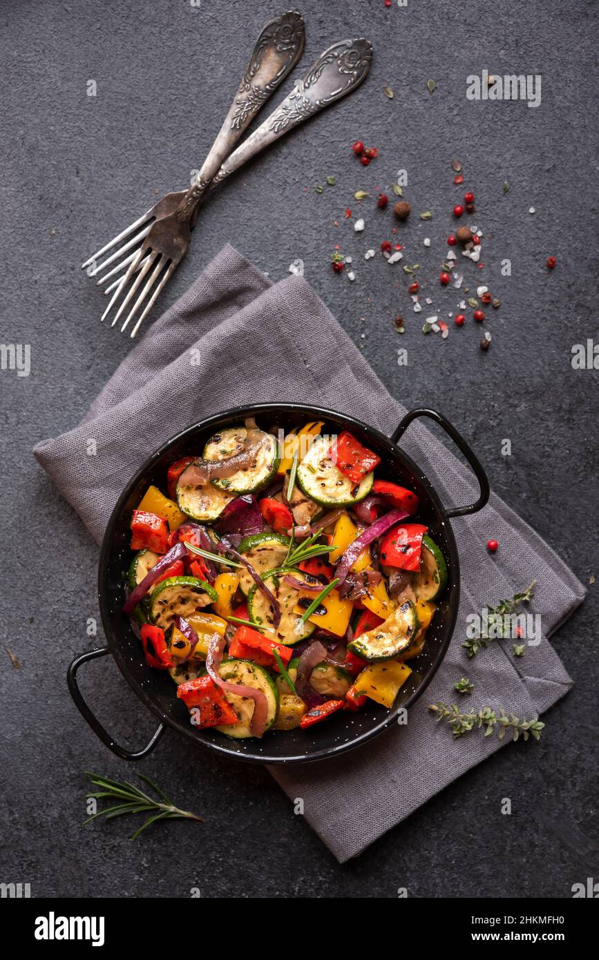 Roasted cooked assorted vegetables with herbs and spices Stock Photo ...