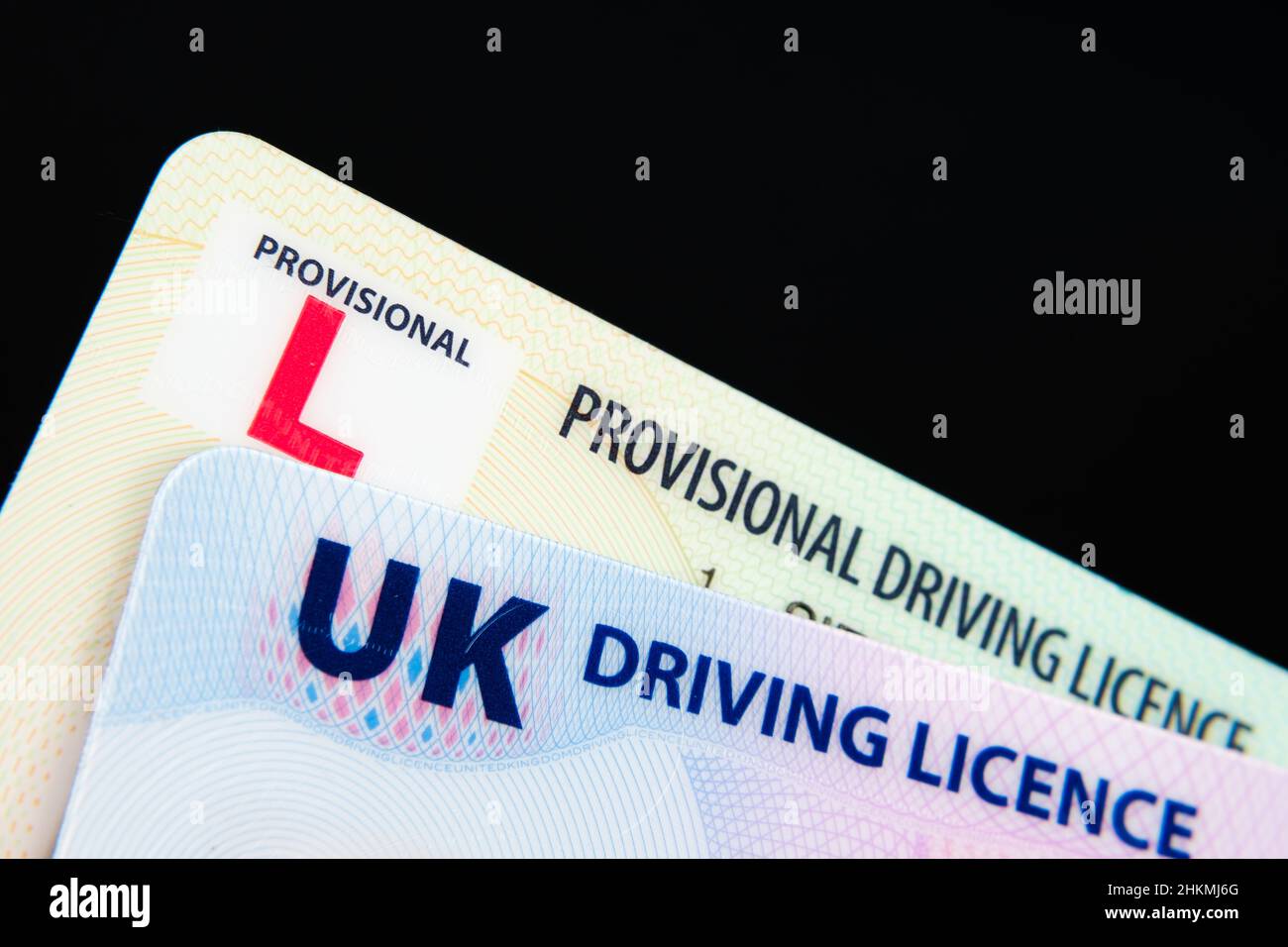 UK Driving Licence. Provisional and Full licence cards isolated on dark ...