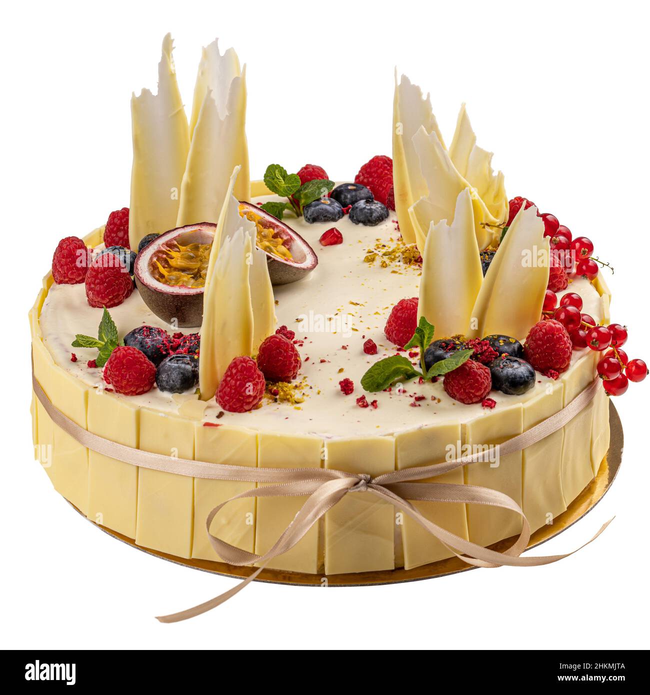 White chocolate cake decorated with passion fruit and raspberry ...