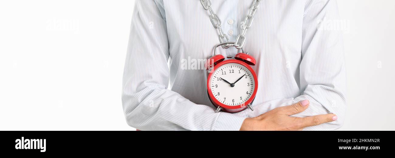 Chain with red alarm clock weighs on woman neck Stock Photo - Alamy