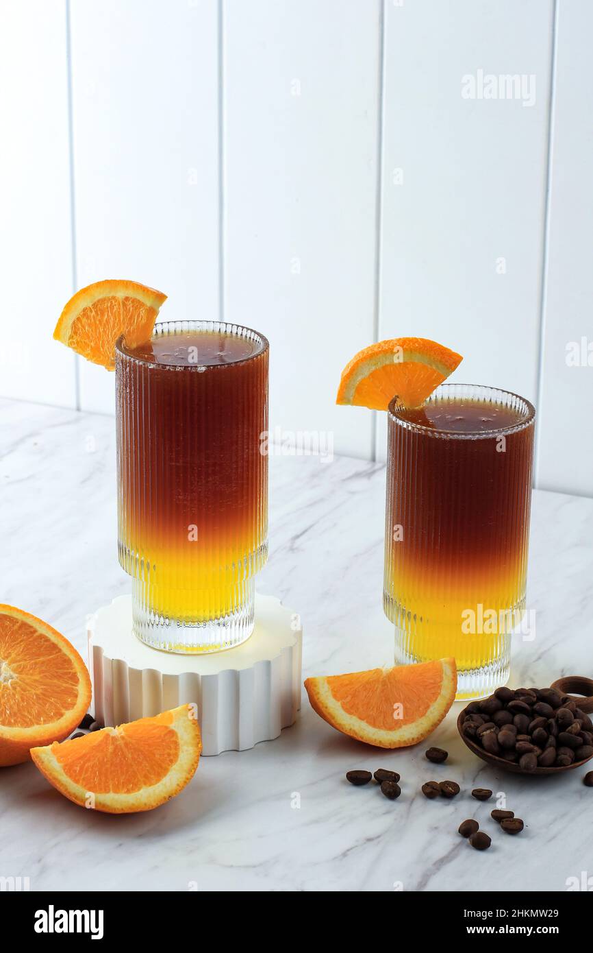 Iced Americano Black Coffee and Layer of Orange and Lemon Juice ...