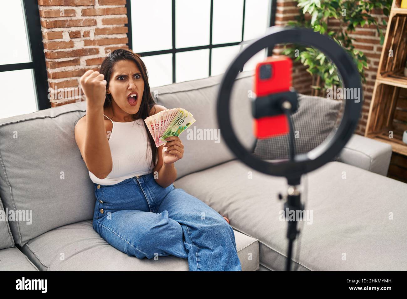 Angry young woman recording furious hi-res stock photography and images ...