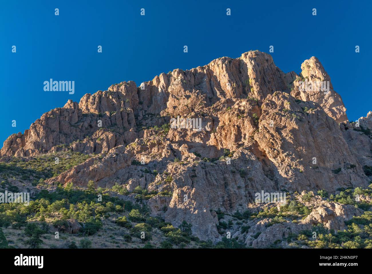 Rhyolite cliffs over Sunny Flat Campground, at sunset, Cave Creek ...