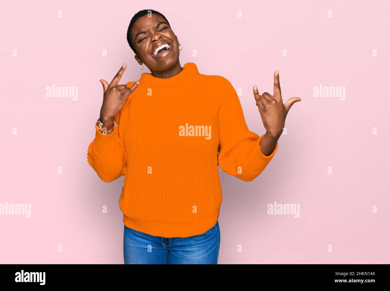 Young african american woman wearing casual clothes shouting with crazy ...