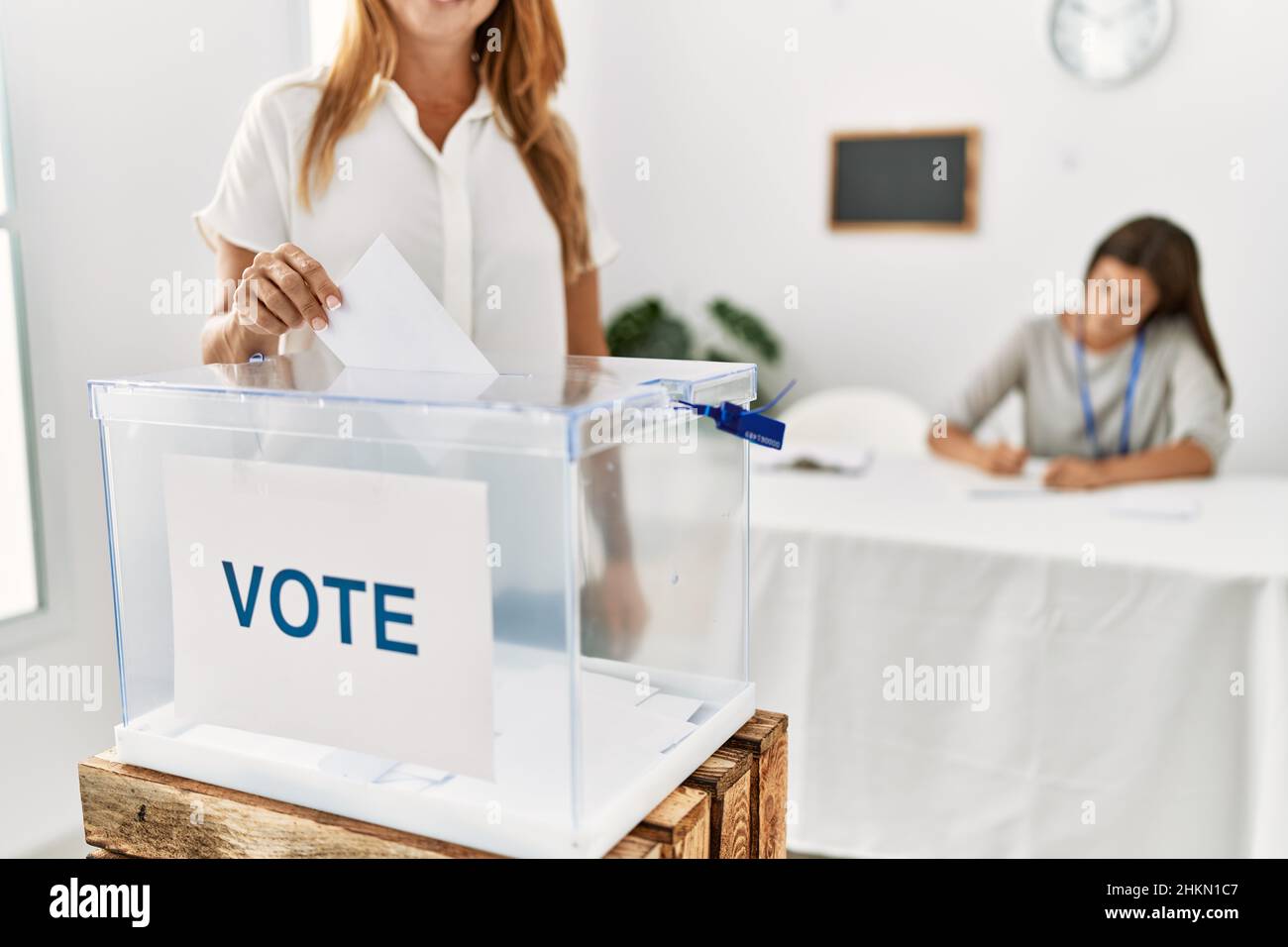 Mother and daughter smiling confident voting at electoral college Stock ...