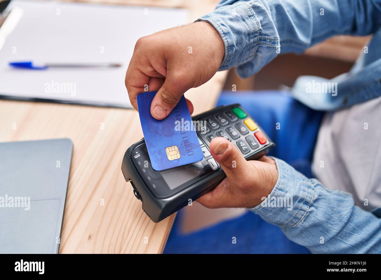 Down syndrome man ecommerce business worker using data phone and credit ...