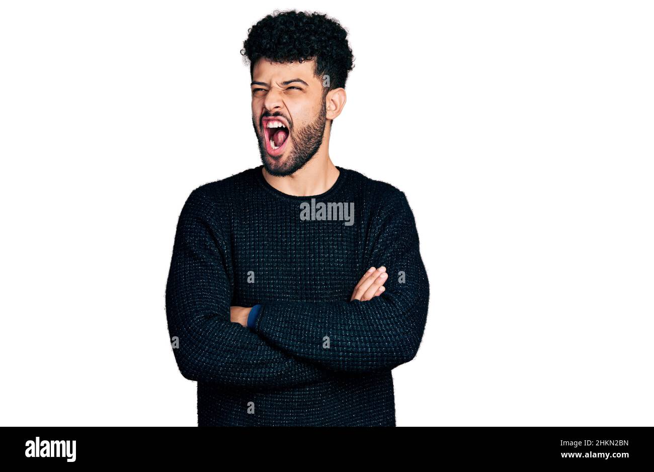Young arab man with beard with arms crossed gesture angry and mad ...