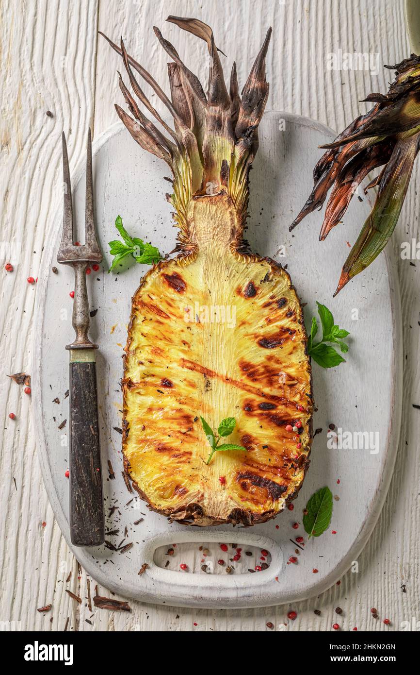 Tasty burned pineapple with herbs and pepper. Roasted pineapple on ...