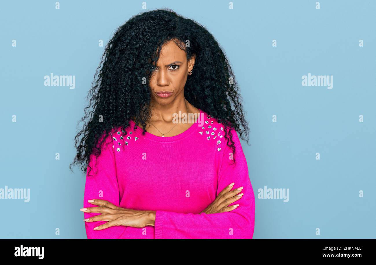 Middle age african american woman wearing casual clothes skeptic and ...