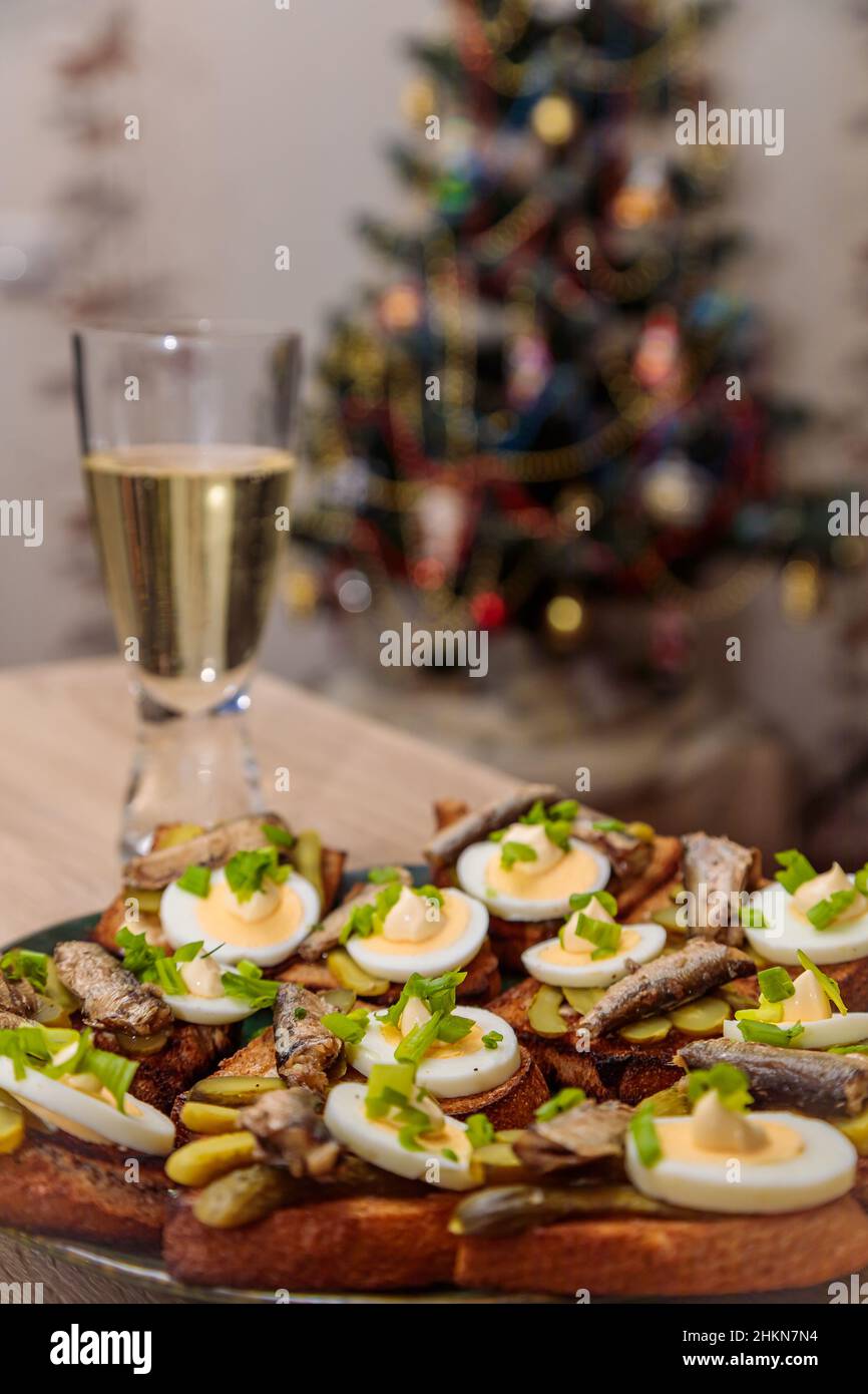 Toasted bread with sprats, eggs and herbs. Traditional Russian food for ...