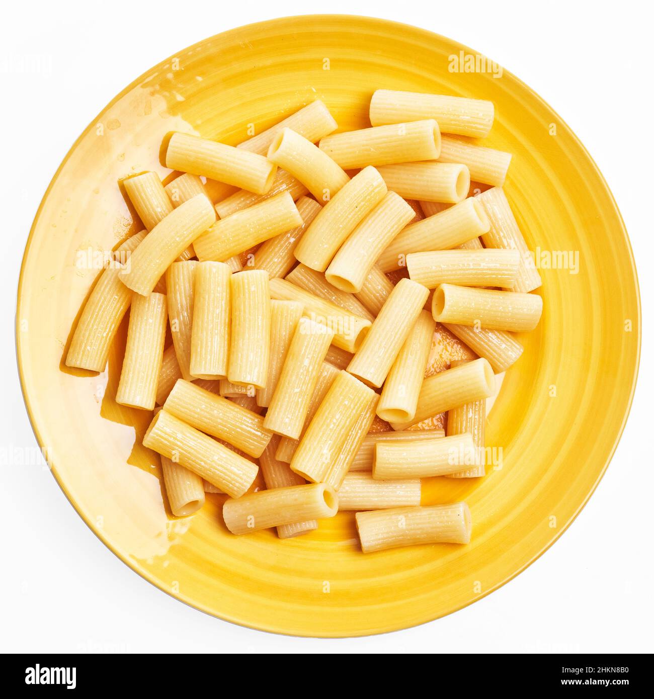 Plate of italian rigatoni pasta over white isolated background Stock ...