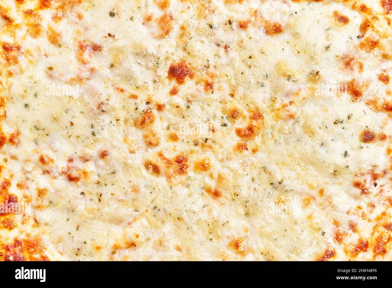 Single italian 4 cheese pizza texture Stock Photo - Alamy