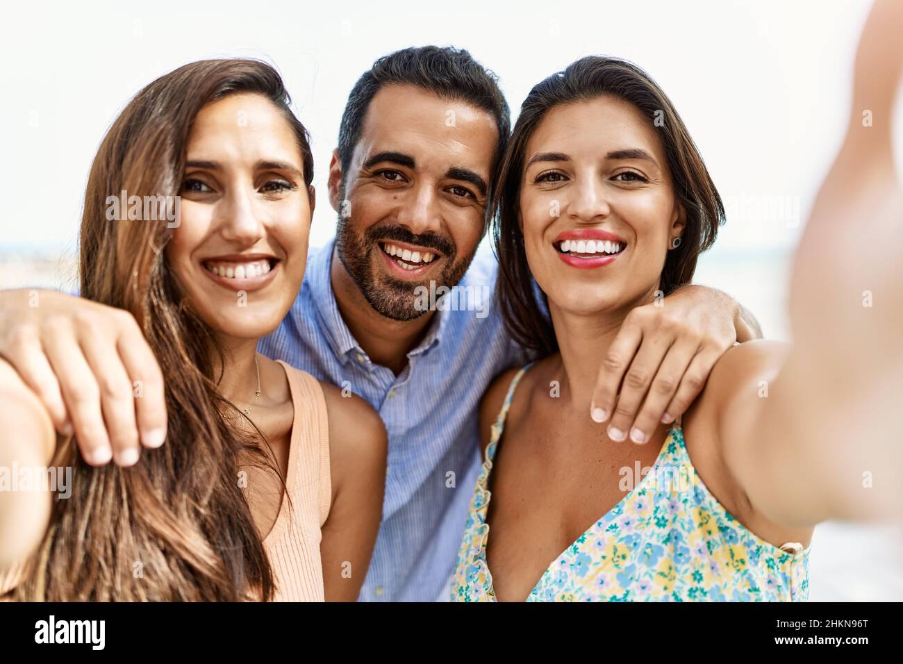 Three young hispanic friends smiling happy and hugging make selfie by ...