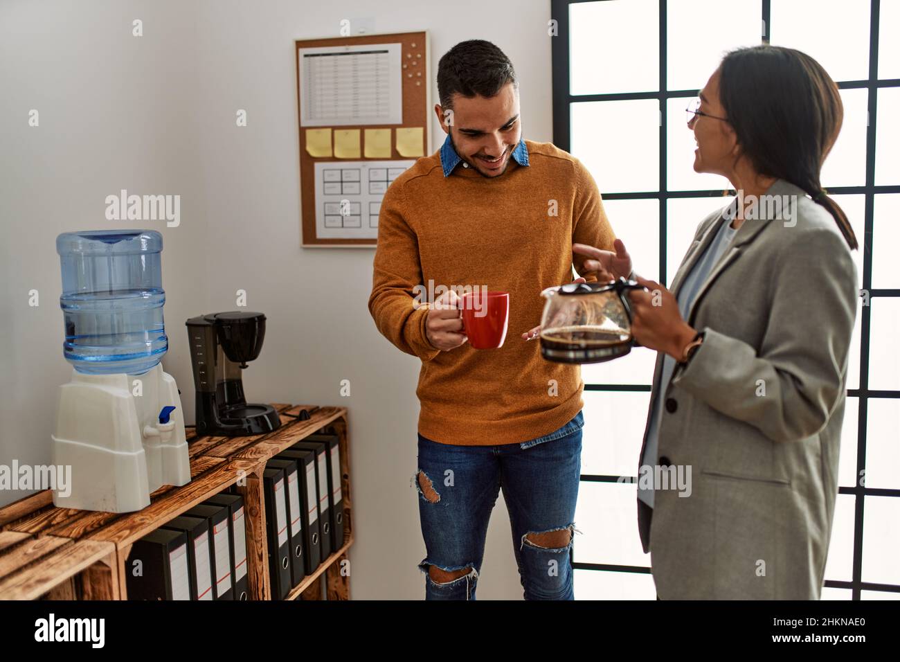 Two business workers relaxed drinking coffee at the office Stock Photo ...