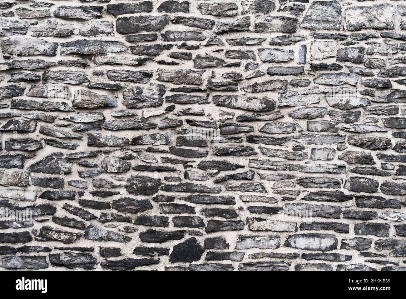 Stone brick wall surface background Stock Photo - Alamy