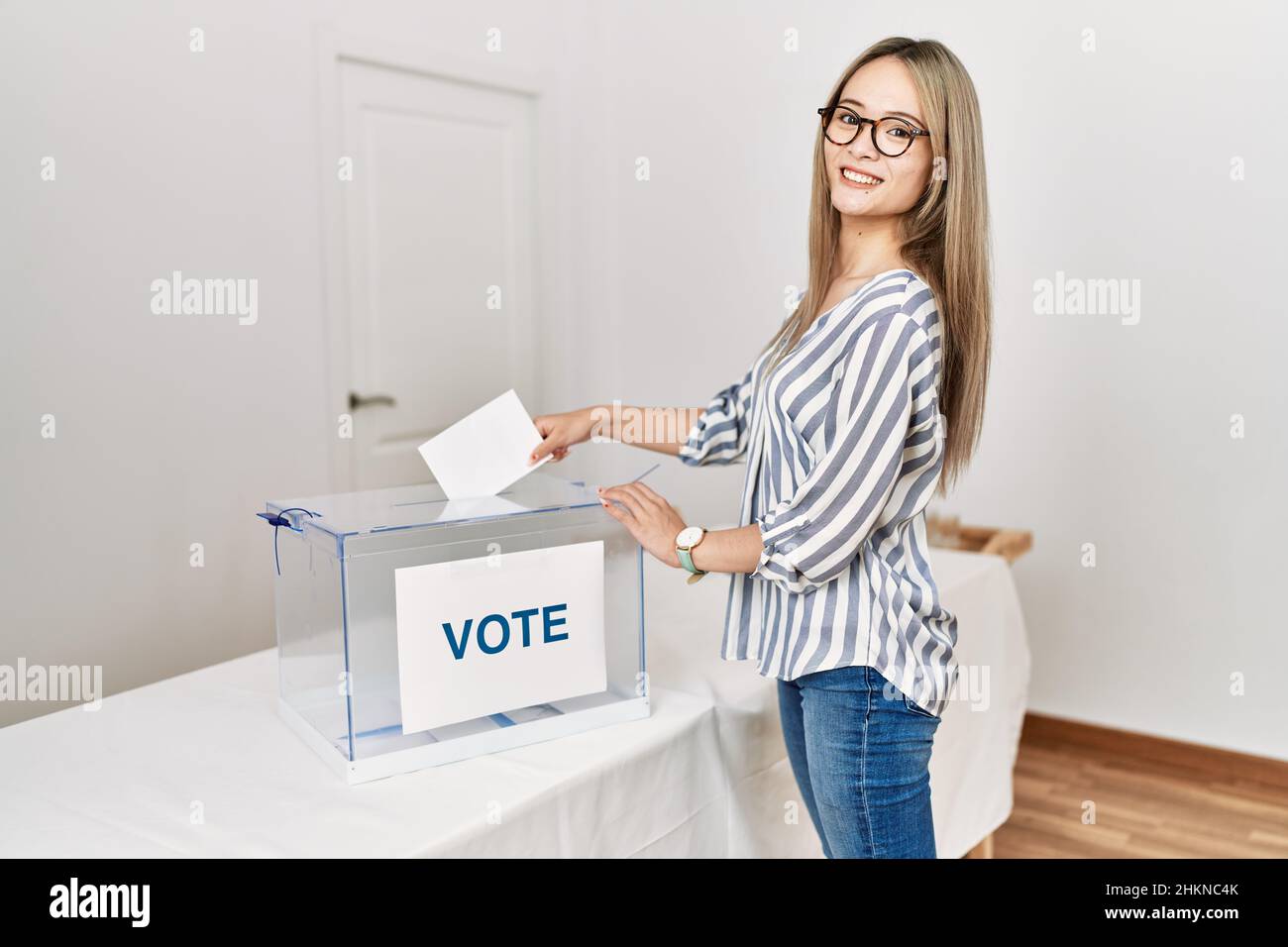 Young chinese woman smiling confident voting at electoral college Stock ...