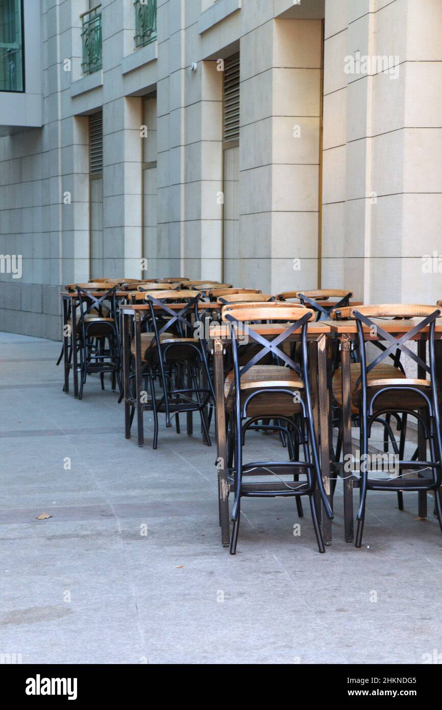 Free outdoor seats in the closed summer cafe. Closed establishment and ...