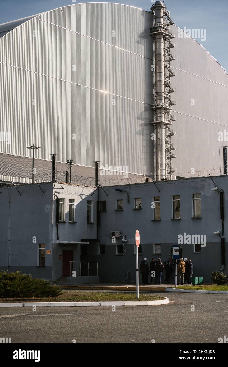 A group of employees take a smoke break outside the New Safe ...