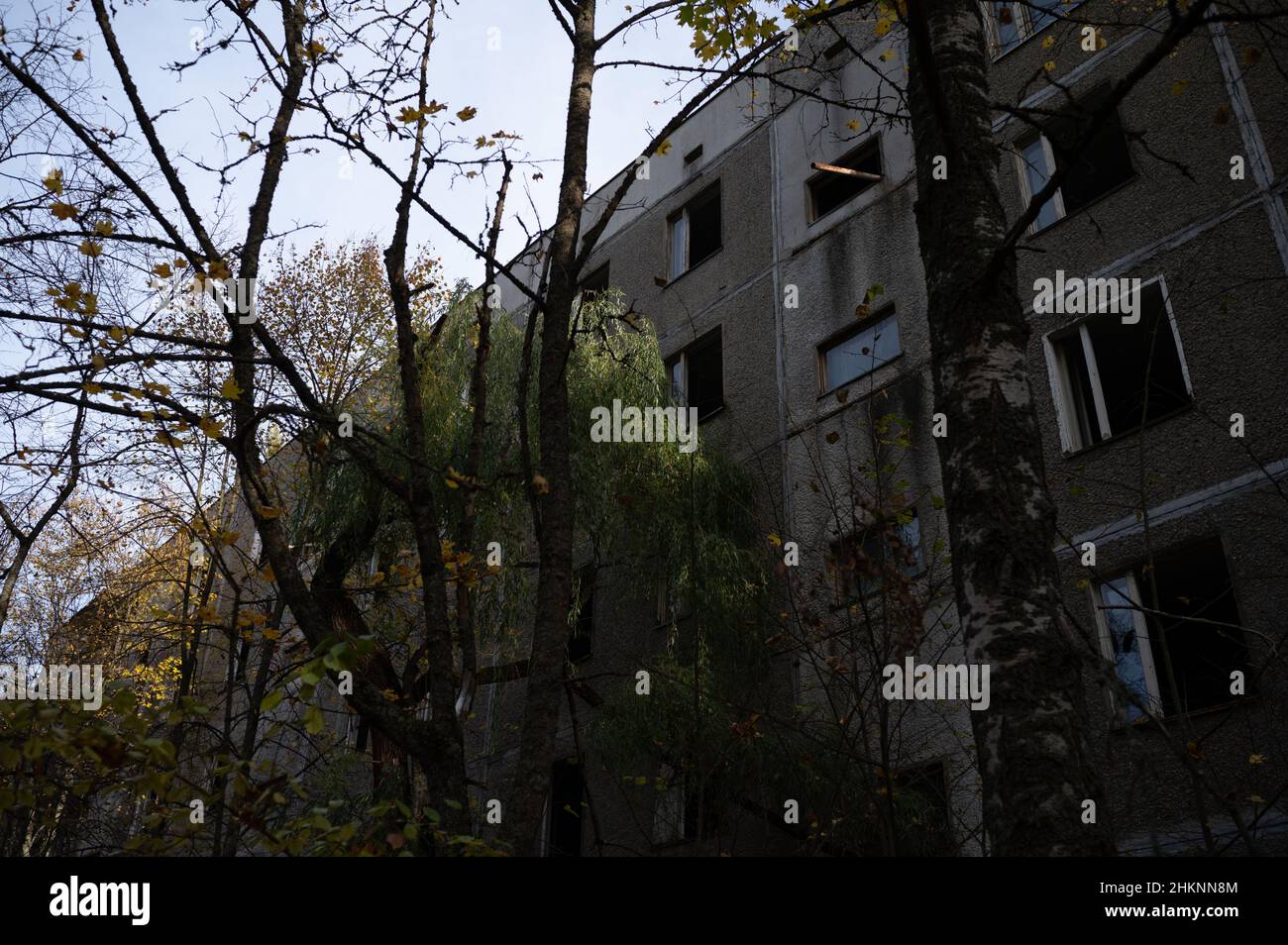 Abandoned buildings and artifacts lie in various states of ...