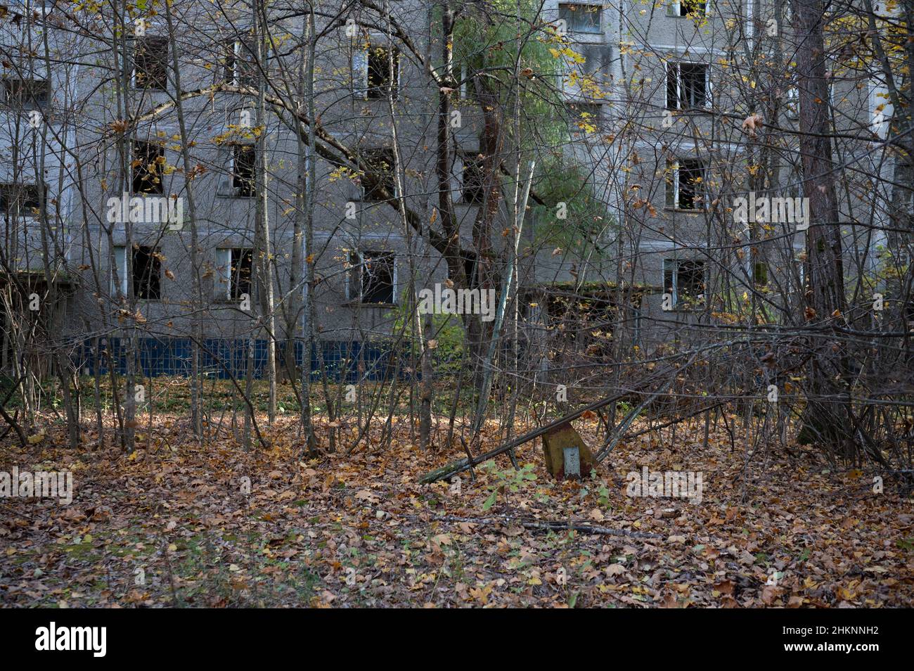 Abandoned buildings and artifacts lie in various states of ...