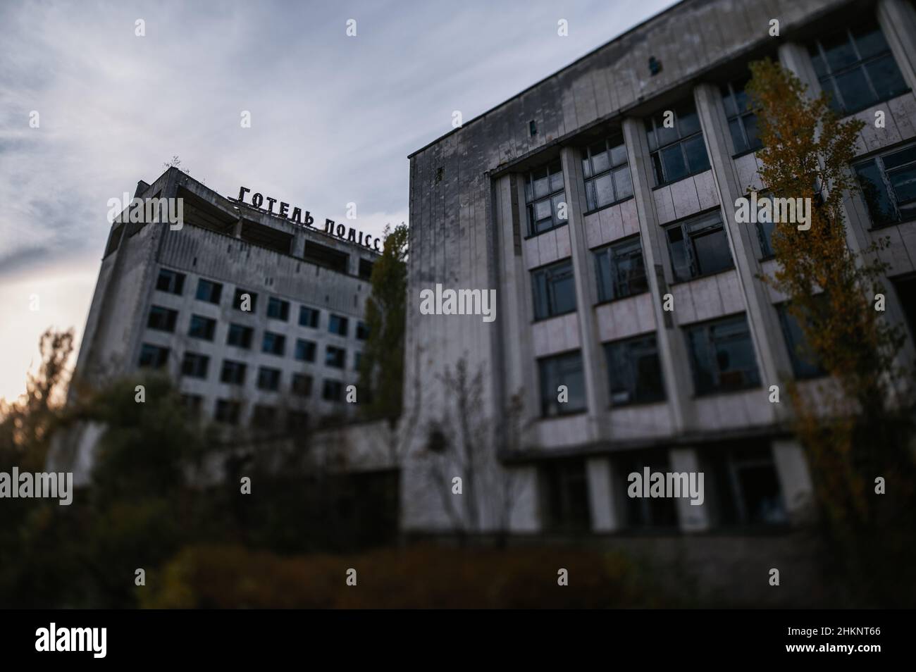 Abandoned buildings and artifacts lie in various states of ...