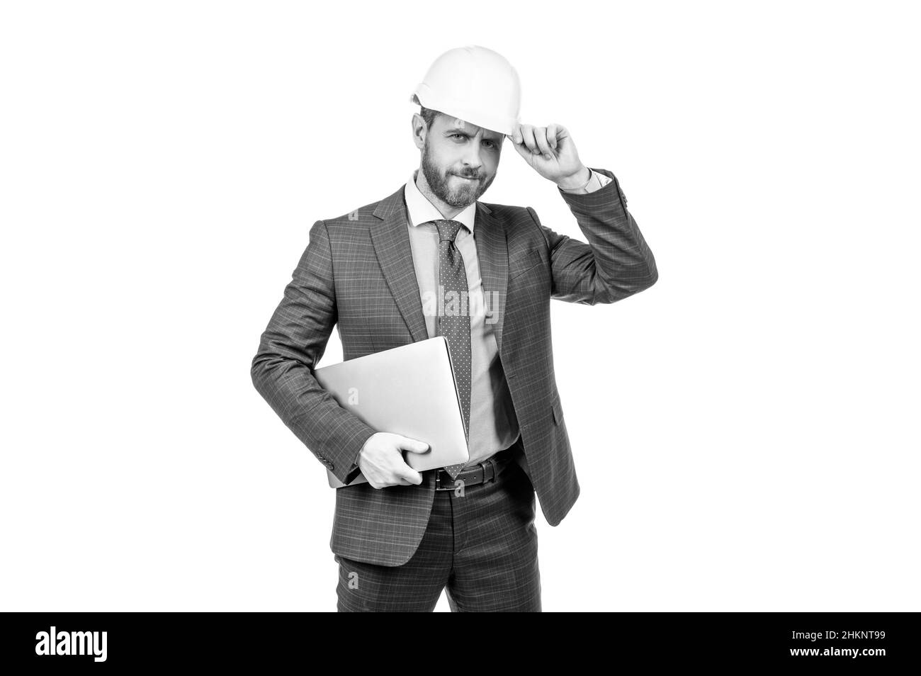 confident businessman man in suit and helmet hold computer isolated on ...