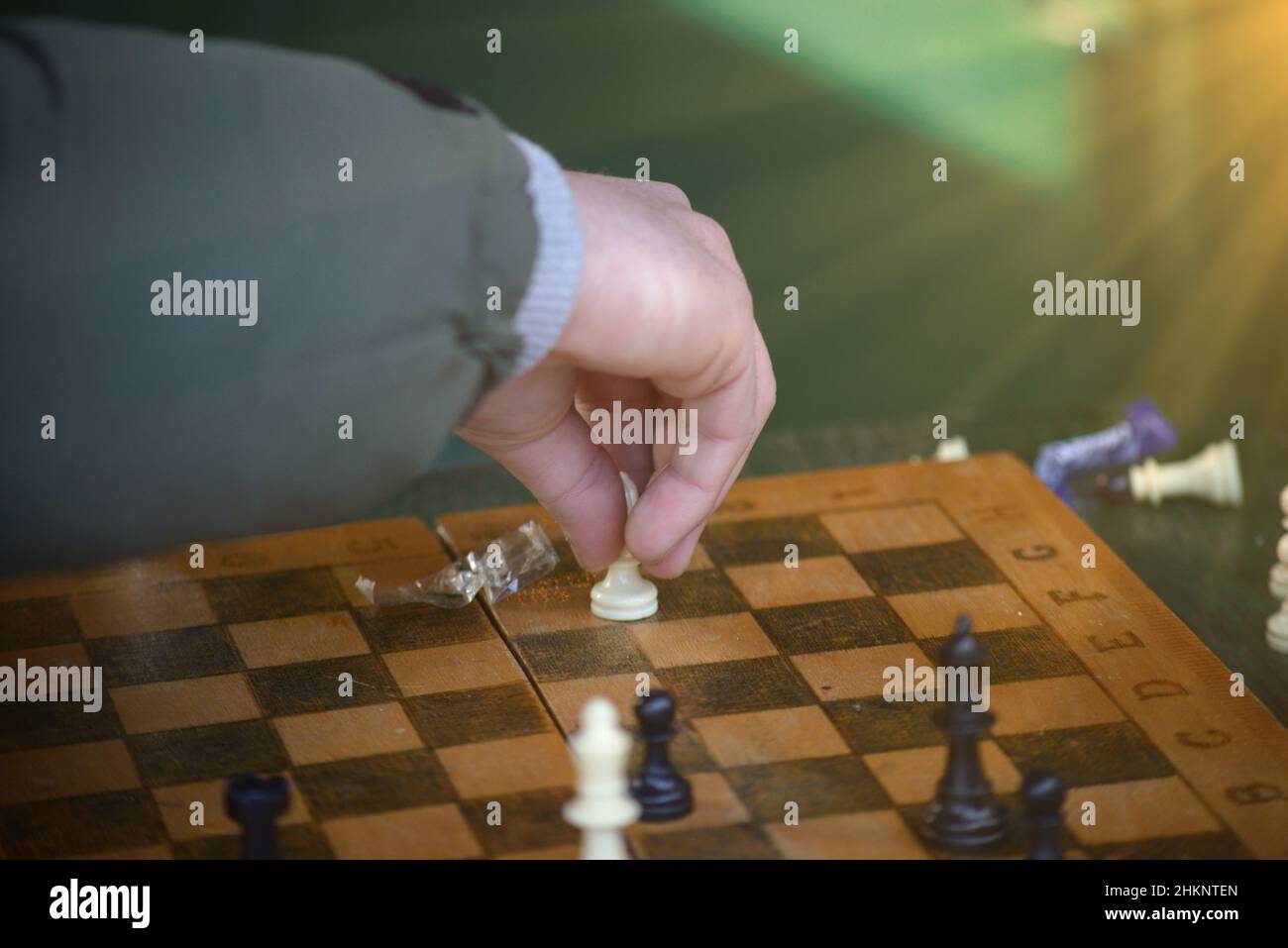 hand of a man playing chess outdoor Stock Photo - Alamy
